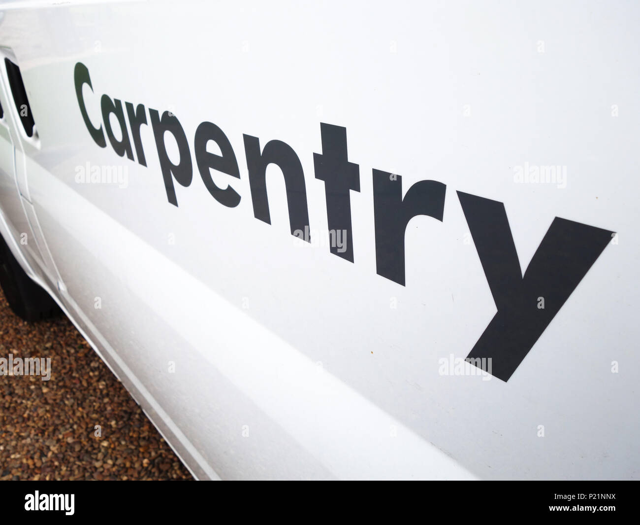 Carpentry sign writing on a Professional trades van Stock Photo - Alamy