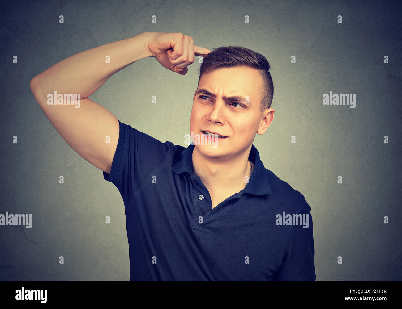 Closeup portrait man scratching head, thinking about something, looking ...