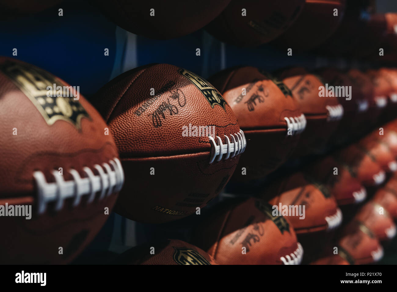 Rows of american football balls in NFL Experience in Times Square, New ...