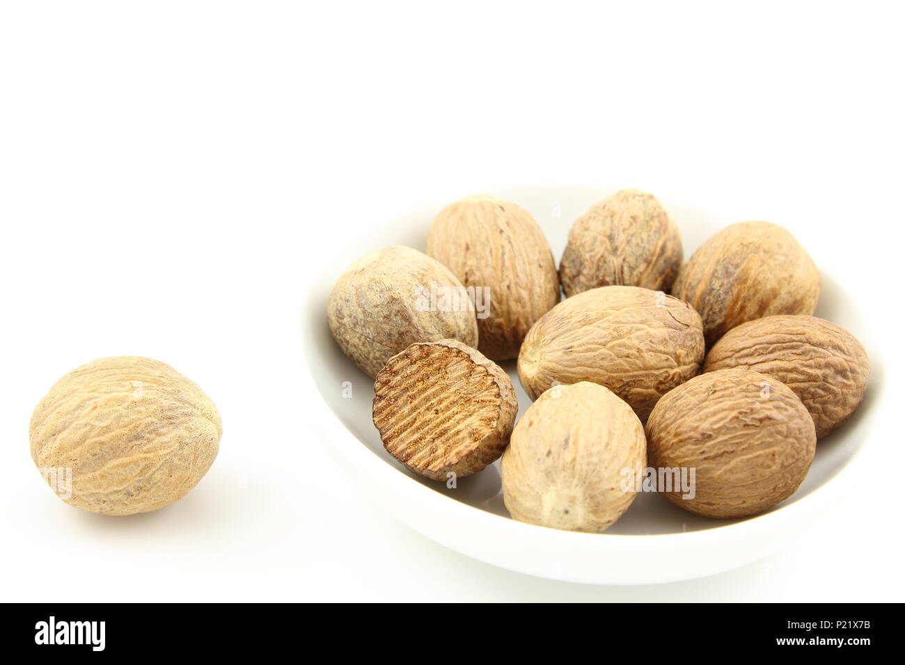 Nutmeg seeds isolated in hi-res stock photography and images - Alamy