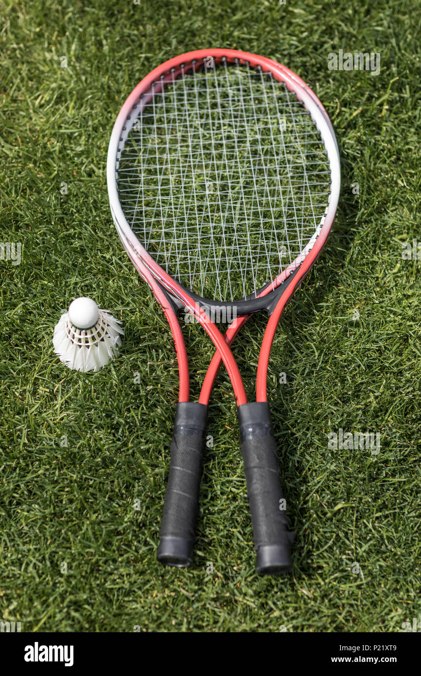top view of badminton rackets with shuttlecock on grass field Stock ...