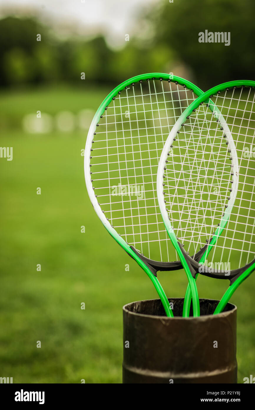 Close-up view of two badminton racquets in container outdoors Stock ...