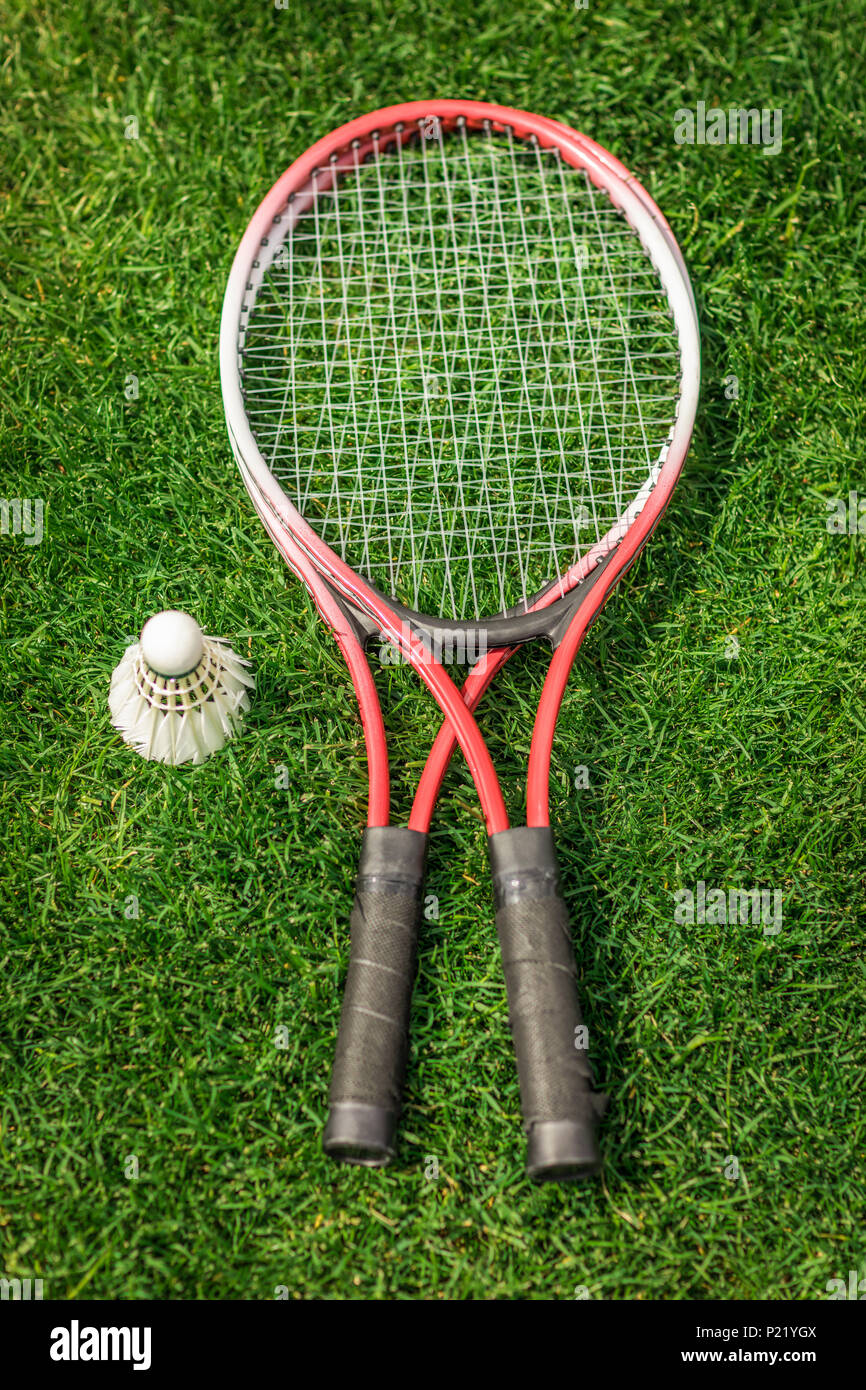 top view of badminton rackets with shuttlecock on grass field Stock ...