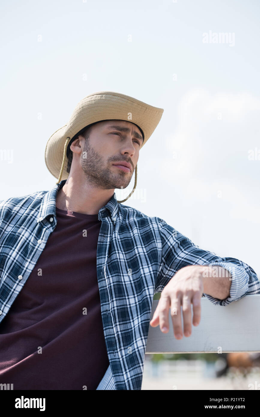 Cowboy leaning on fence hi-res stock photography and images - Alamy