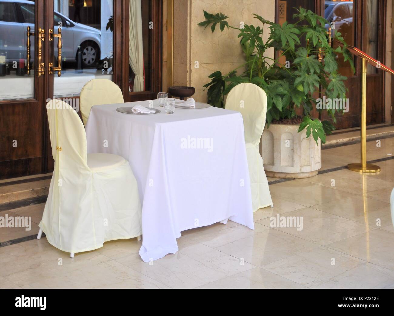 Outdoor tables for breakfast of a hotel Stock Photo - Alamy