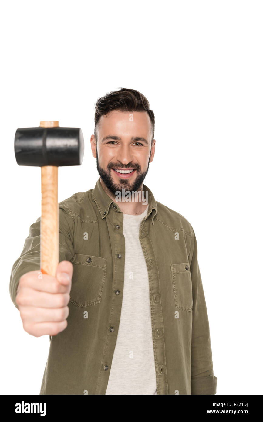 portrait of smiling man showing hammer in hand and looking at camera ...
