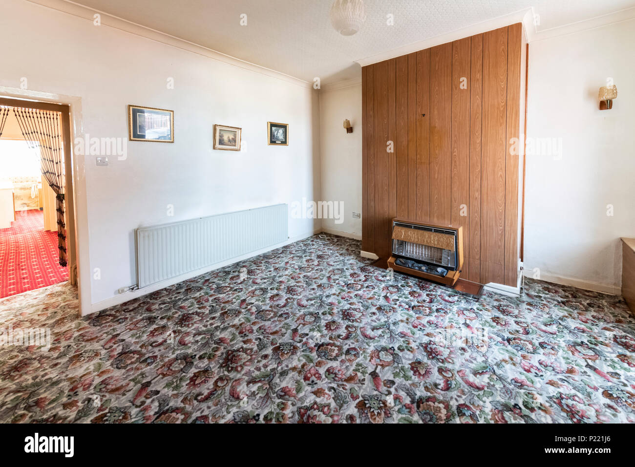 Well worn interior living space of a victorian terraced house in the ...