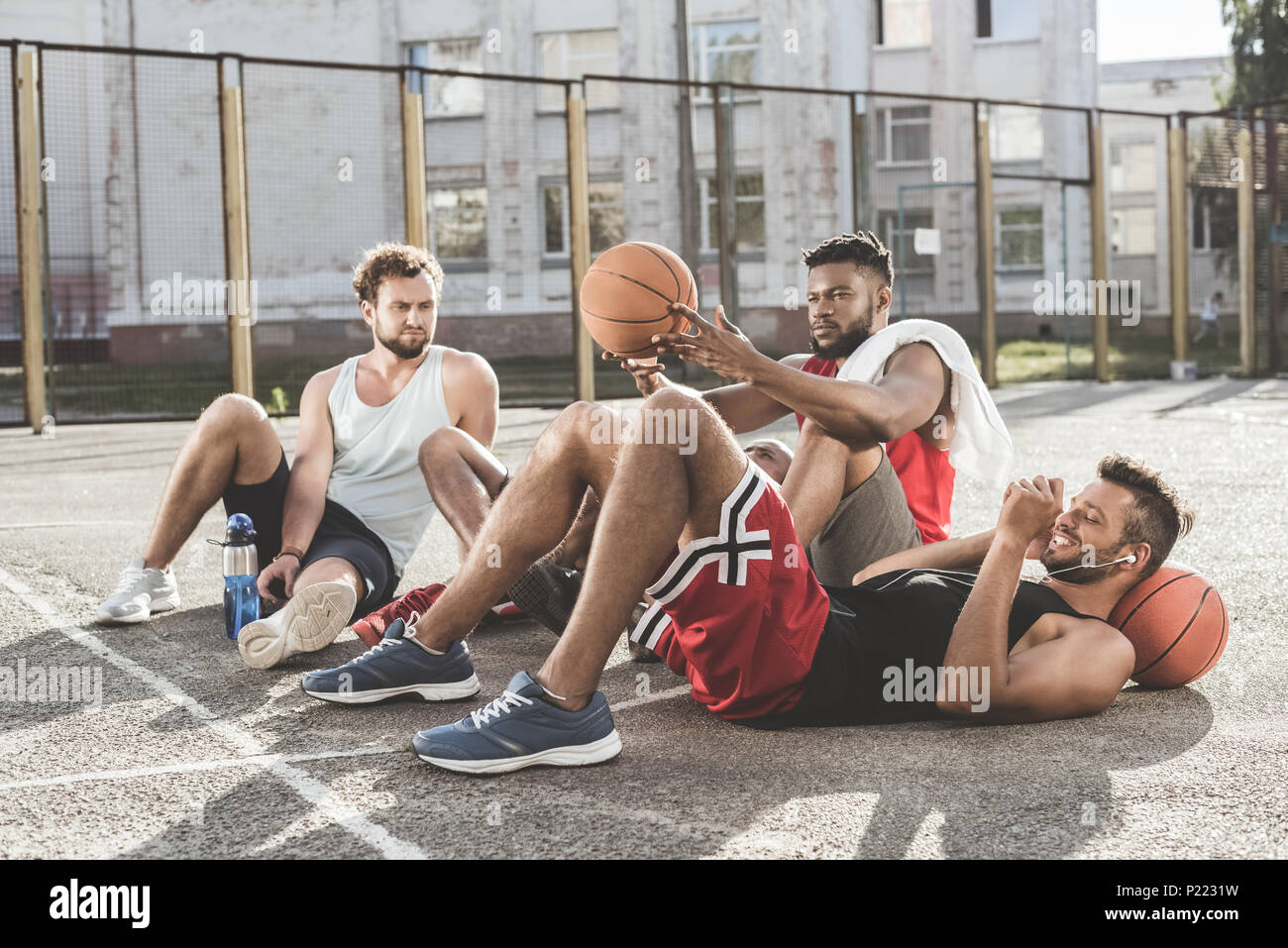 Group of men resting hi-res stock photography and images - Alamy
