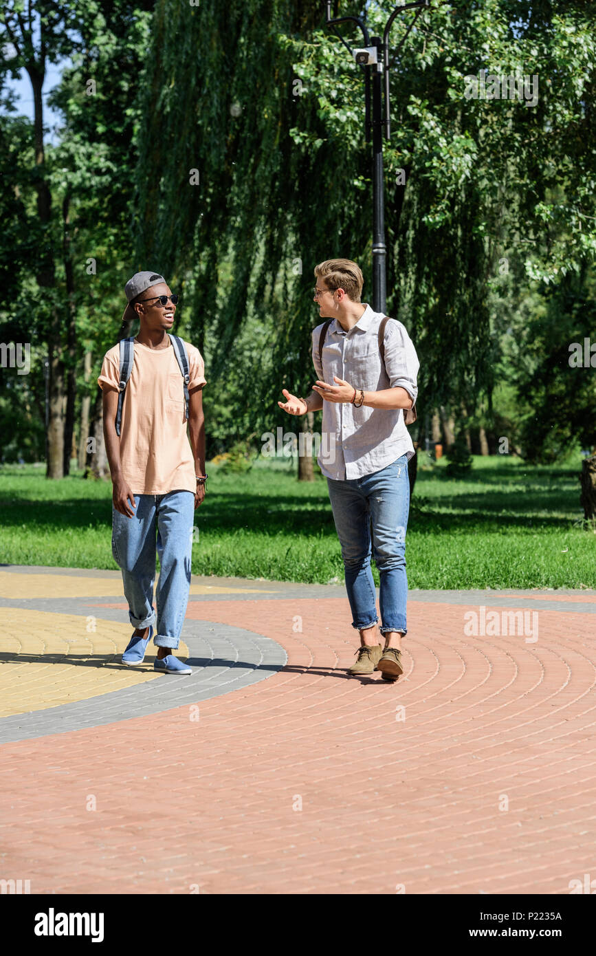 Walking friends park hi-res stock photography and images - Alamy