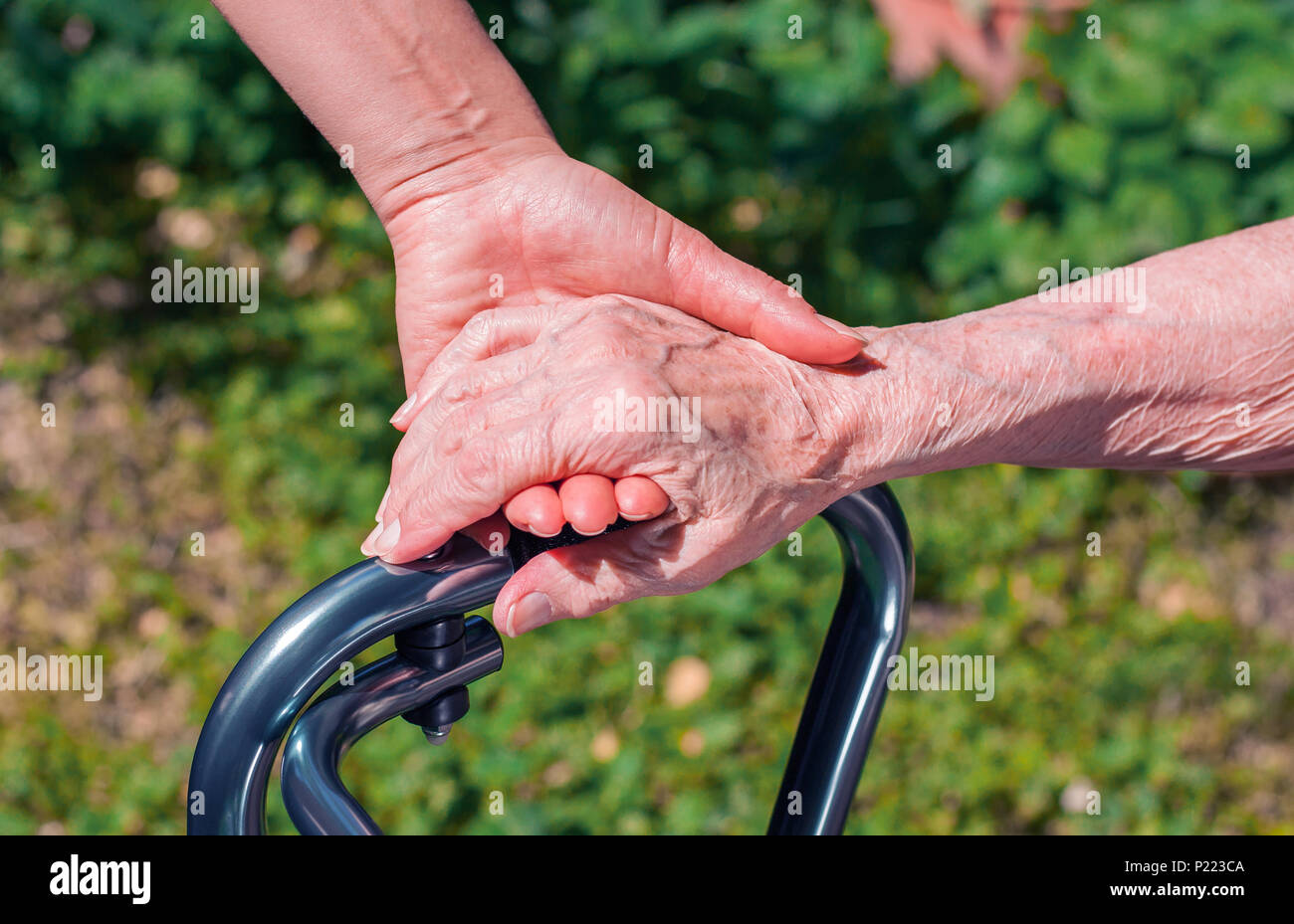 Helping hand elderly hi-res stock photography and images - Alamy