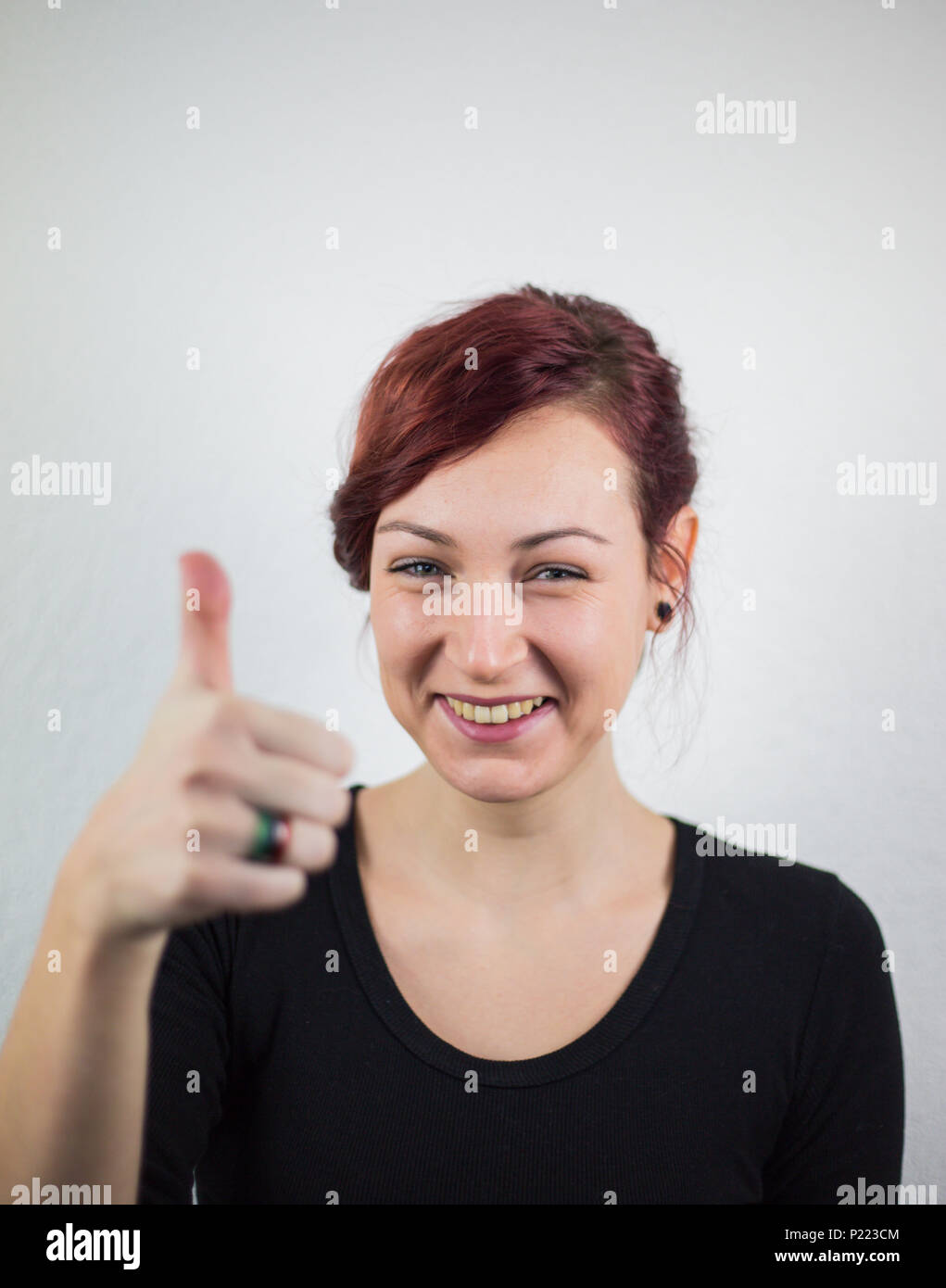 A young girl shows facial expressions that the job is done well, white ...