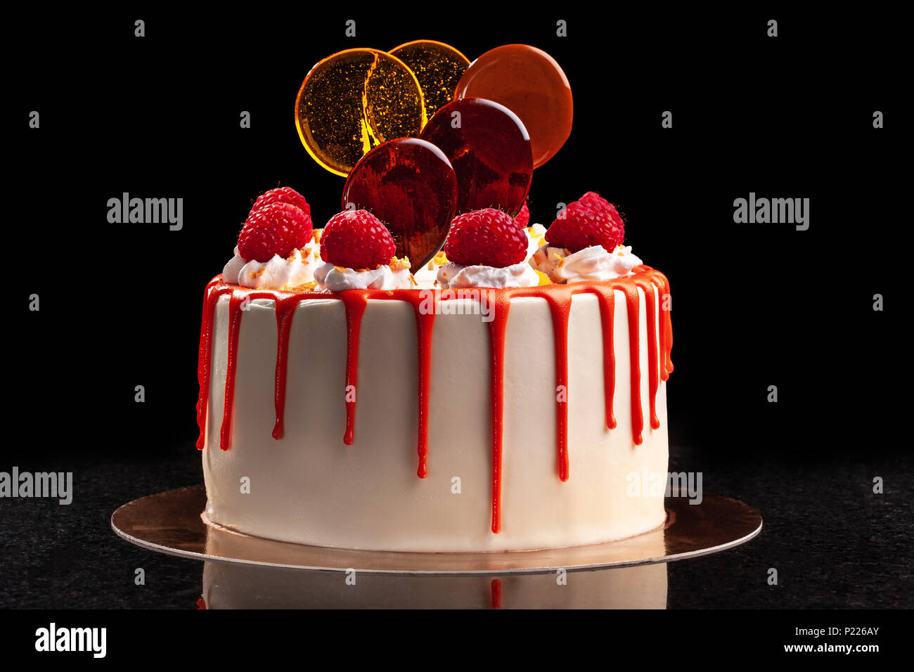 Raspberry cream mousse cake no baked cheesecake on black background ...