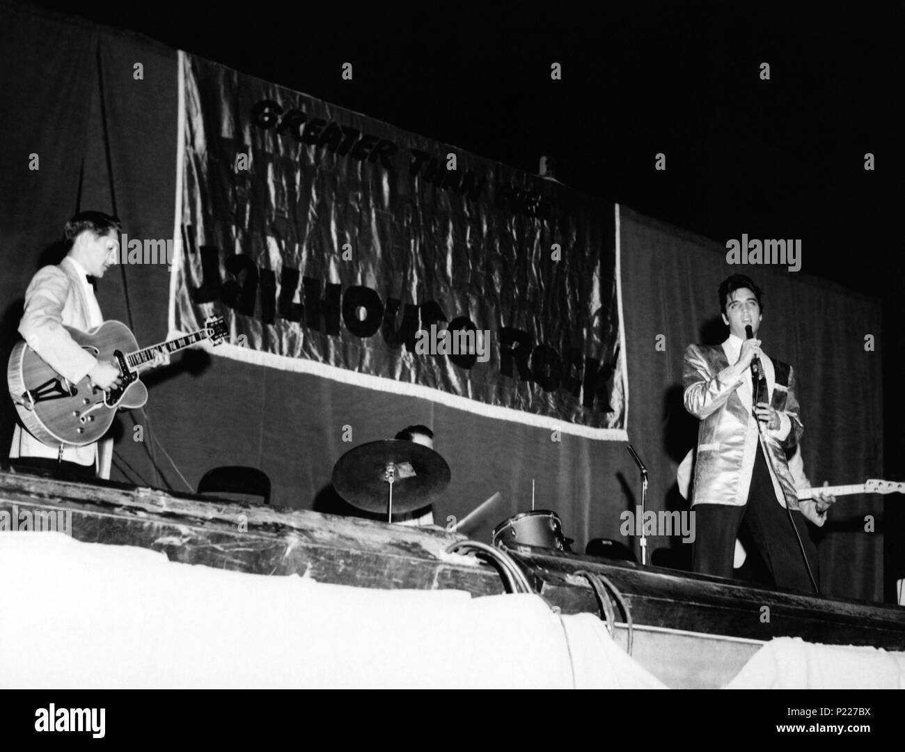 The American singer Elvis Presley during a concert Stock Photo - Alamy