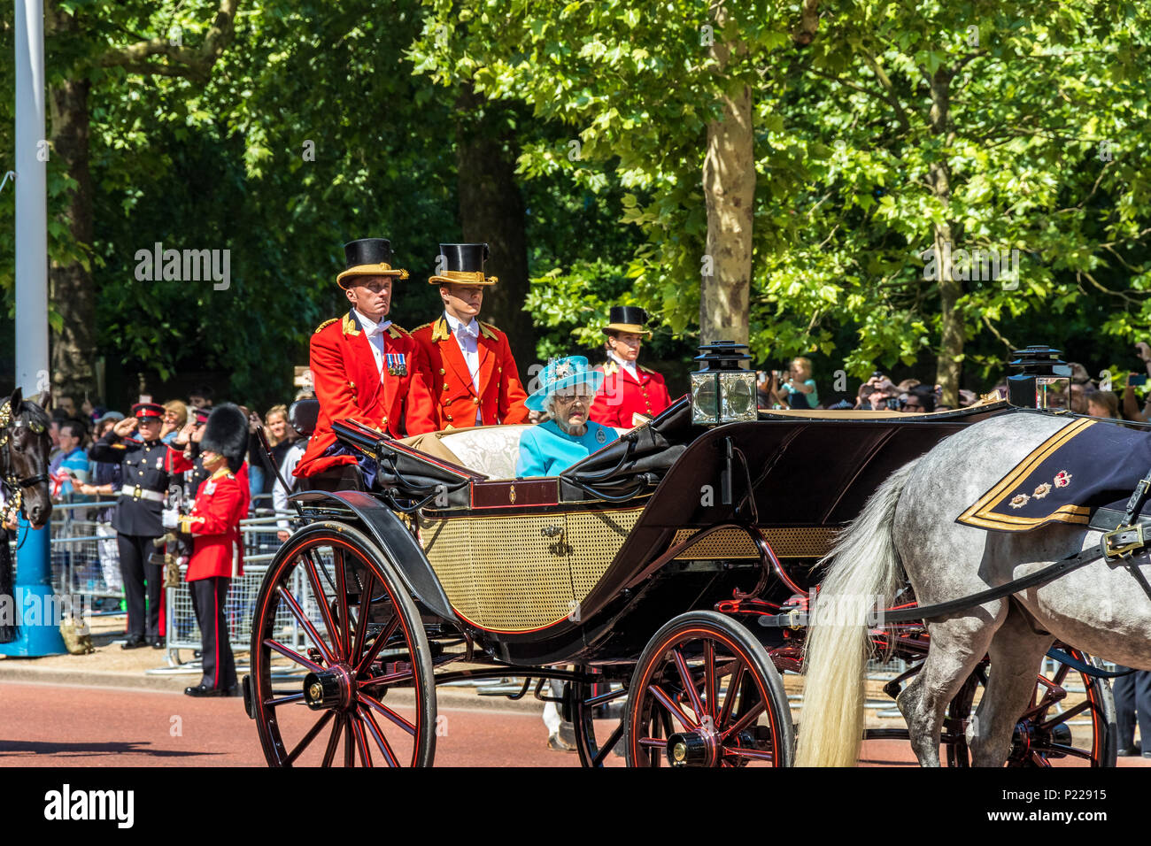 Her Majesty The The Queen rides alone in a carriage along The Mall at ...