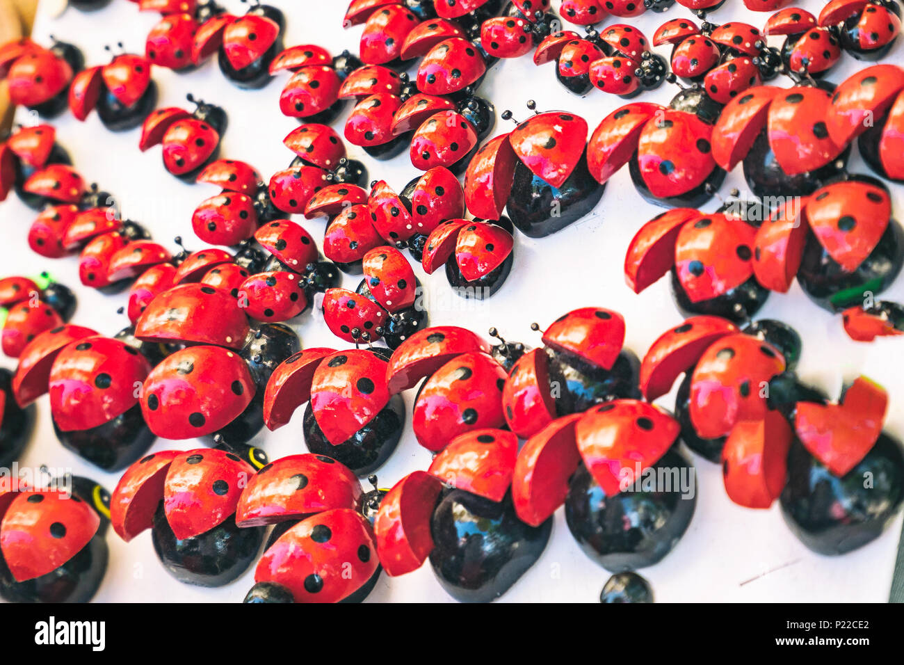 Many artificial lady bug toy Stock Photo - Alamy