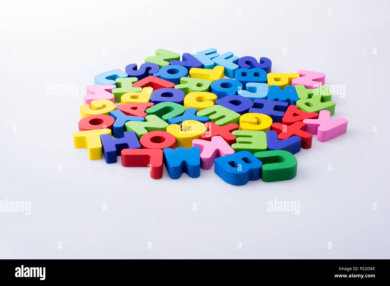 Colorful alphabet letter blocks scattered randomly on white background ...