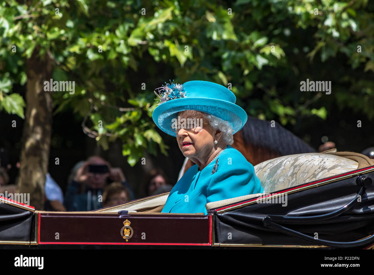 Her Majesty The Queen riding alone in a carriage along The Mall at the ...