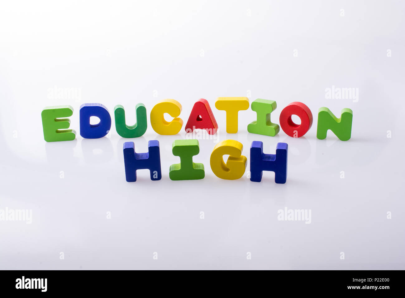 the word HIGH EDUCATION written with colorful letter blocks Stock Photo ...