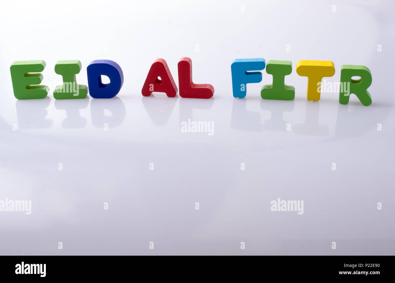 the word EID EL FITR written with colorful letter blocks Stock Photo ...