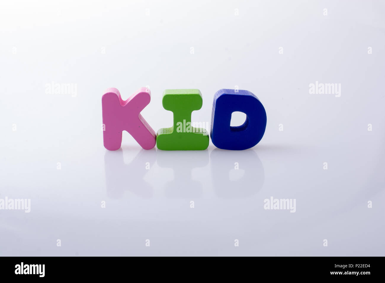the word KID written with colorful letter blocks on white Stock Photo ...