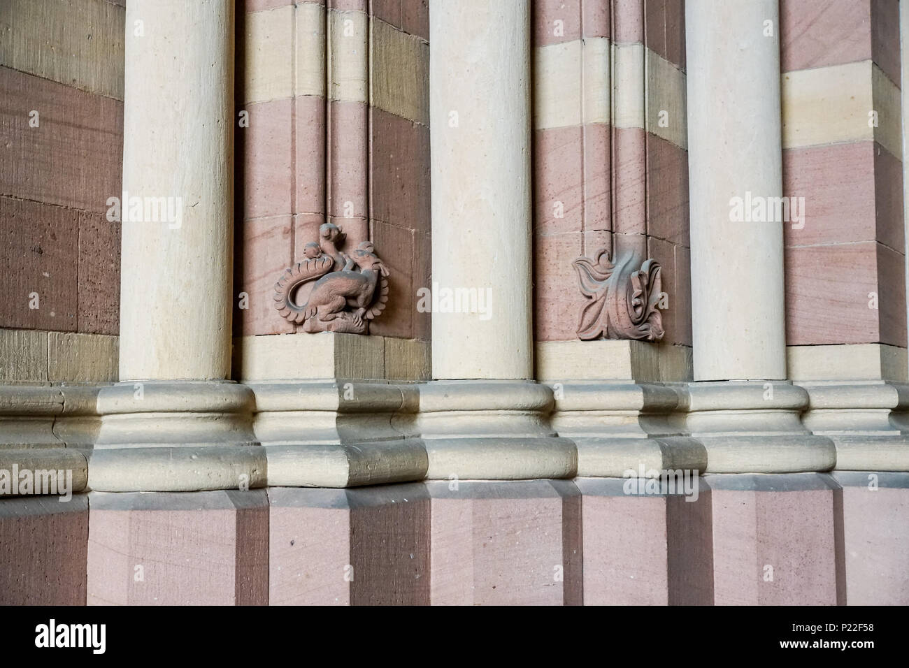 Close up view of pink marble columns at the entrance of a french church ...