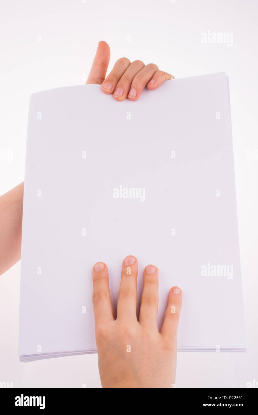 Hand holding a blank paper on a white background Stock Photo - Alamy