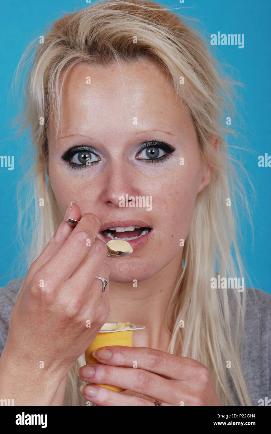 young woman eatin cream Stock Photo - Alamy