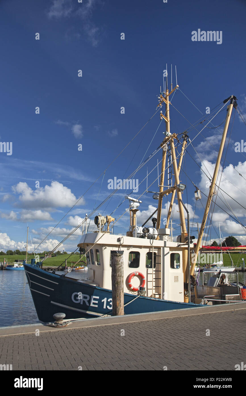 Fishing trawler in the floodgate harbour, Greetsiel, East Friesland ...