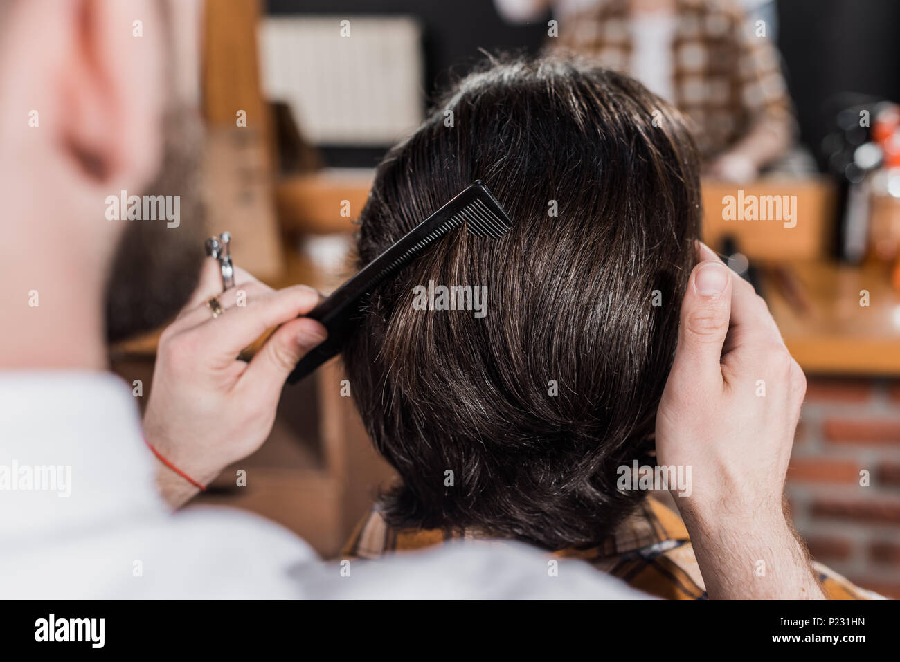 Cropped shot professional barber cutting hi-res stock photography and ...