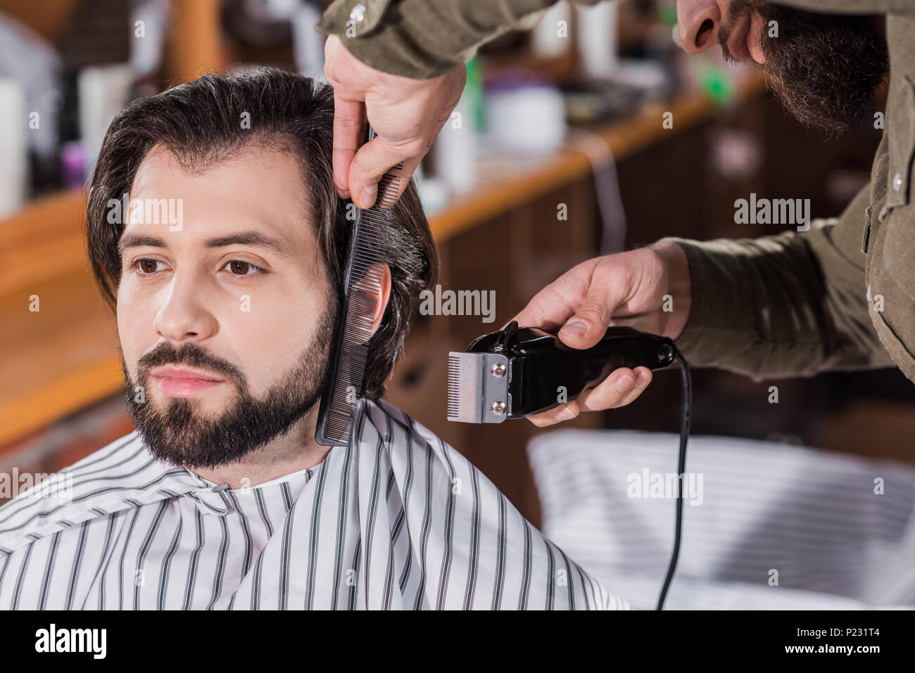 close-up shot of barber shaving man with Hair Clipper Stock Photo - Alamy