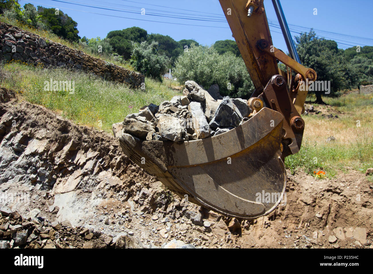 Backhoe loader rocks hi-res stock photography and images - Alamy