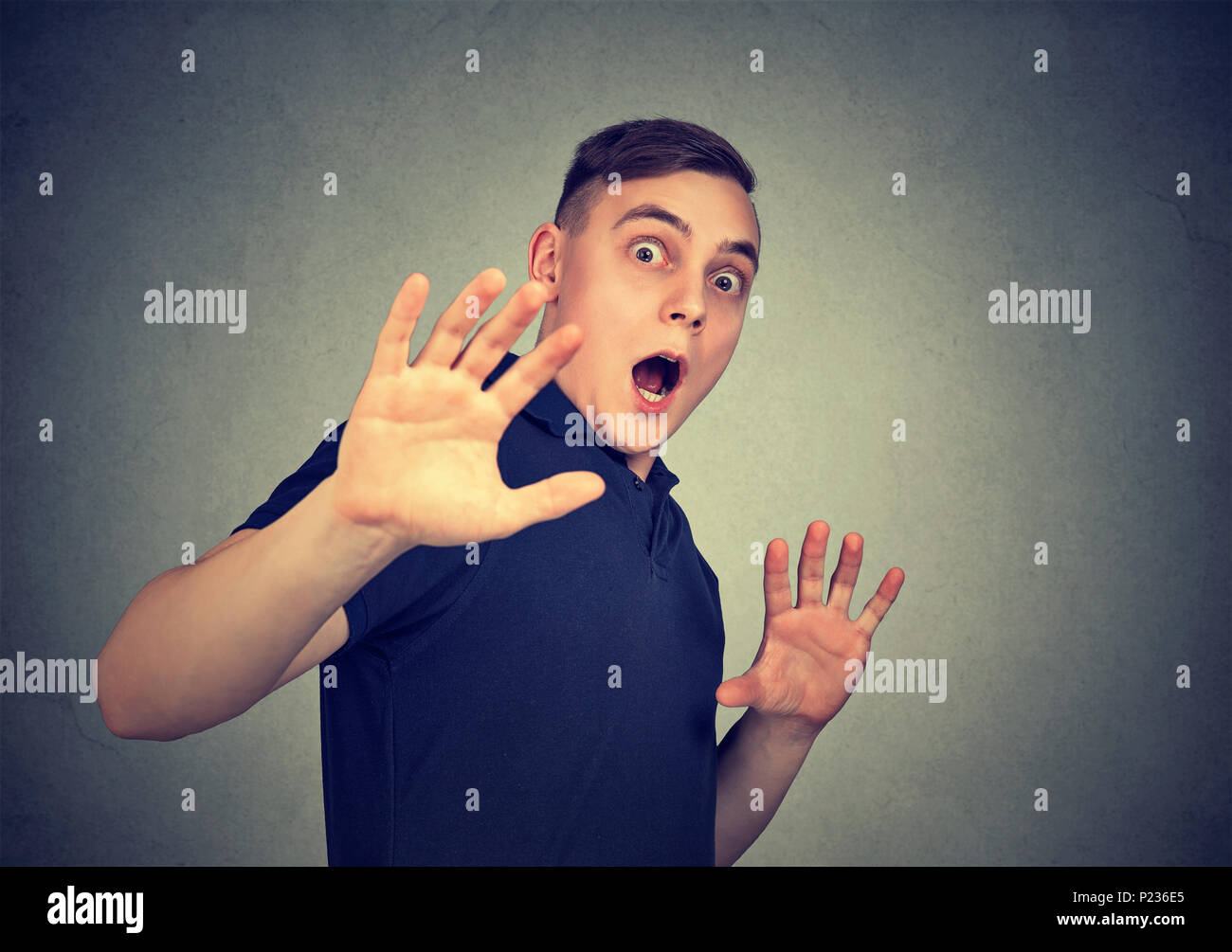 Young scared man with shocked facial expression Stock Photo - Alamy