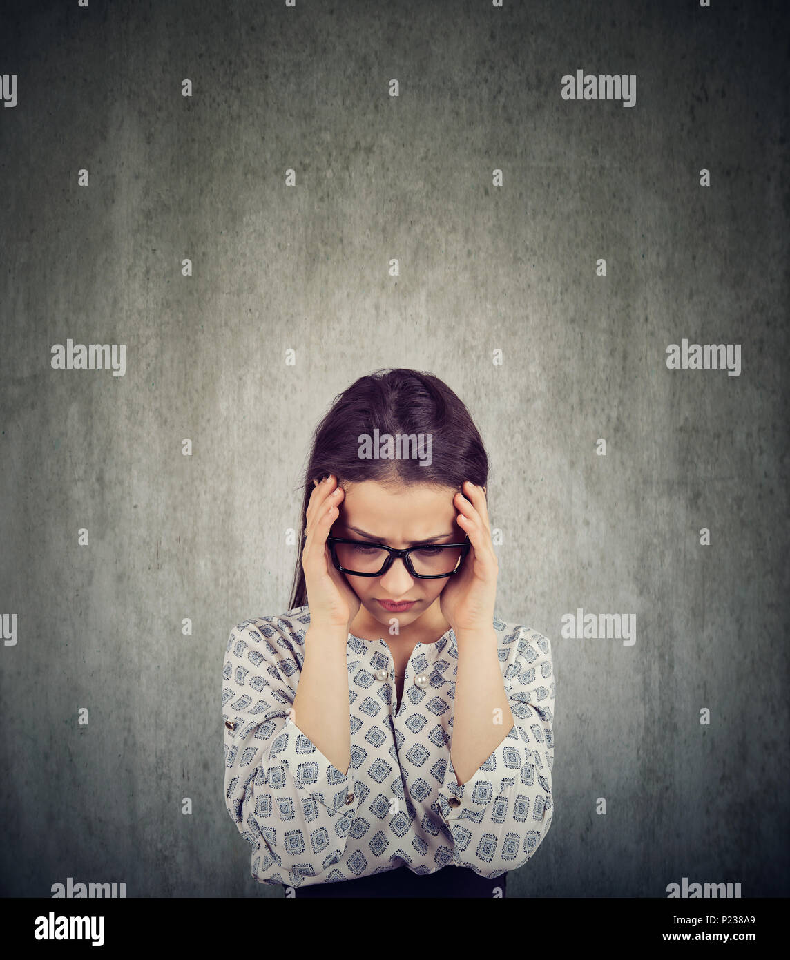 sad young beautiful woman in glasses with worried stressed face ...