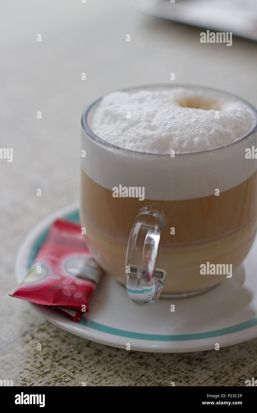 A Small Latte, served in a glass cup Stock Photo - Alamy