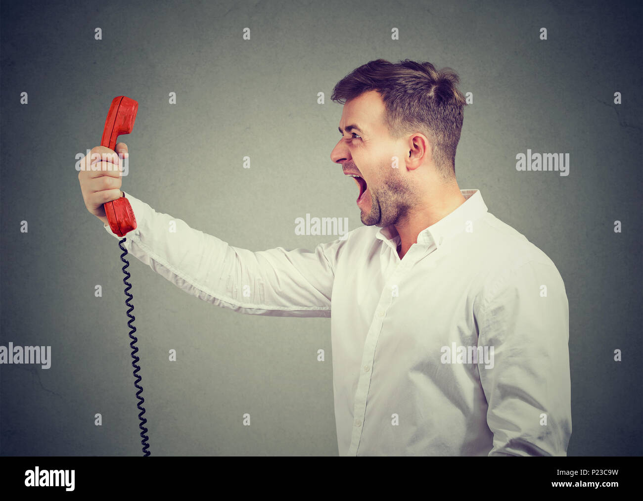 Angry man on phone hi-res stock photography and images - Alamy
