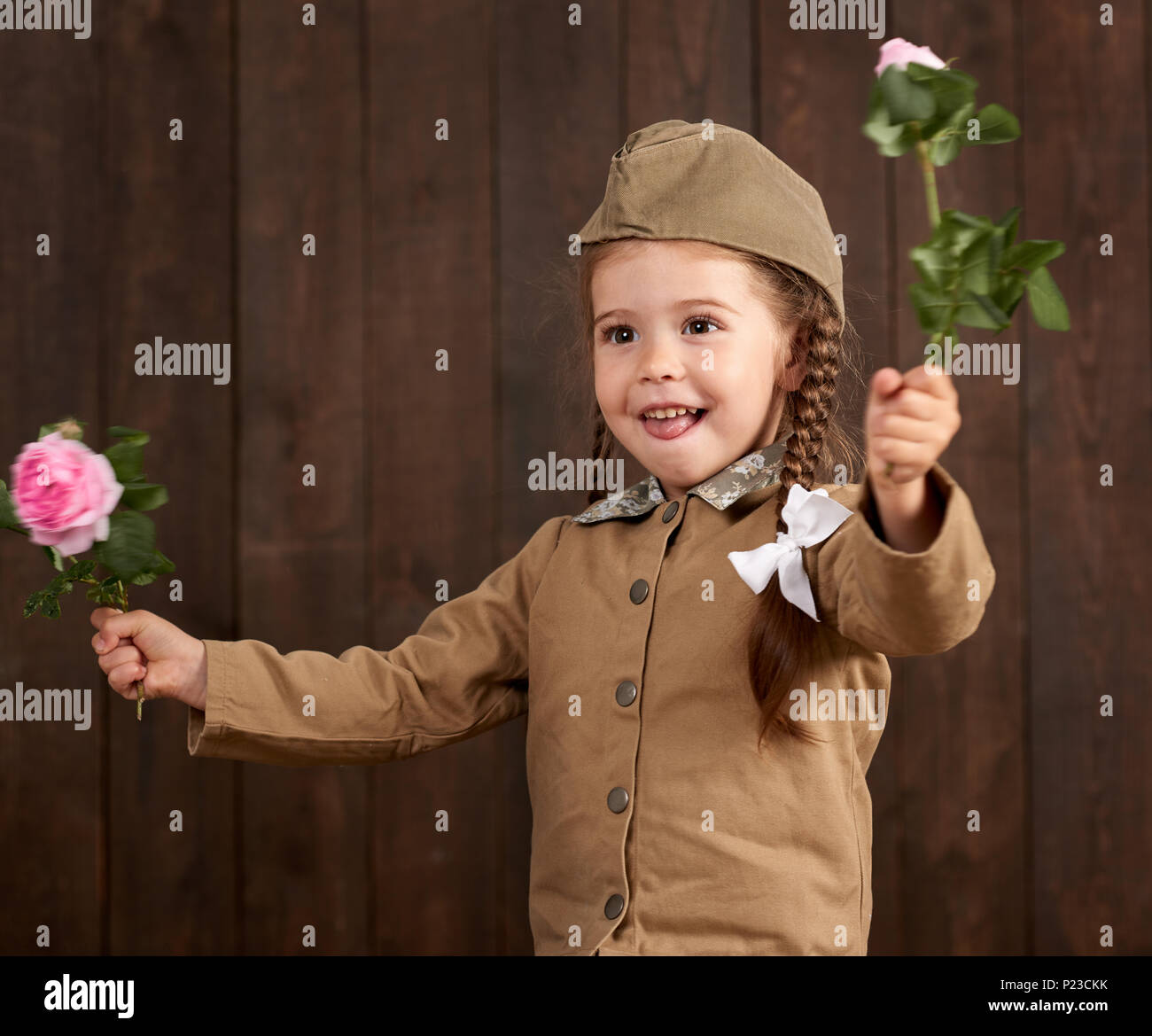 child girl are dressed as soldier in retro military uniforms Stock ...