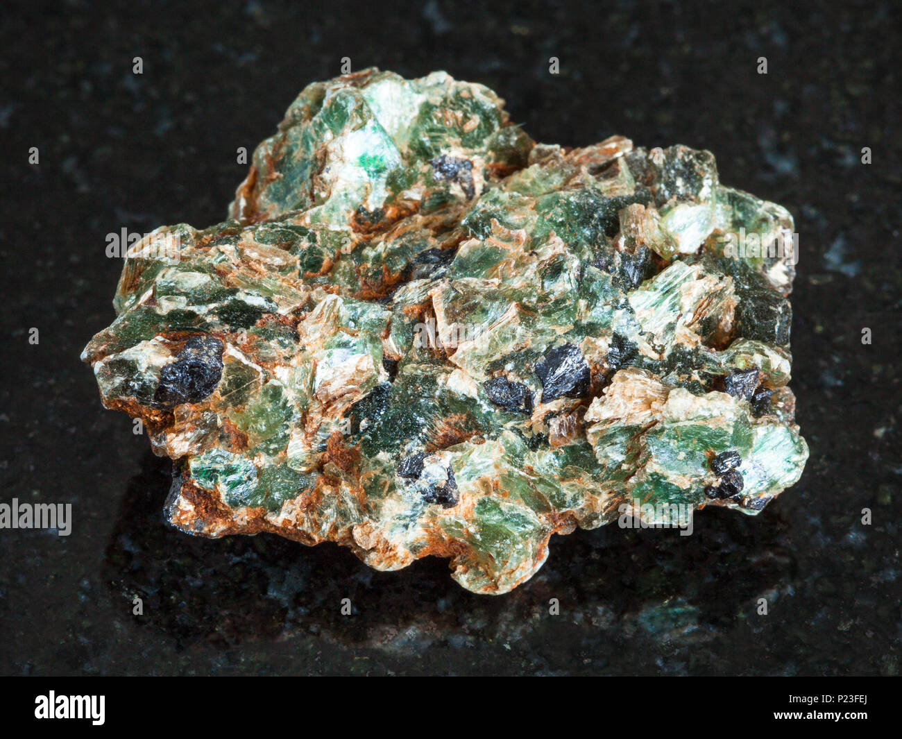 macro shooting of natural mineral - green beryl and emerald crystals in ...
