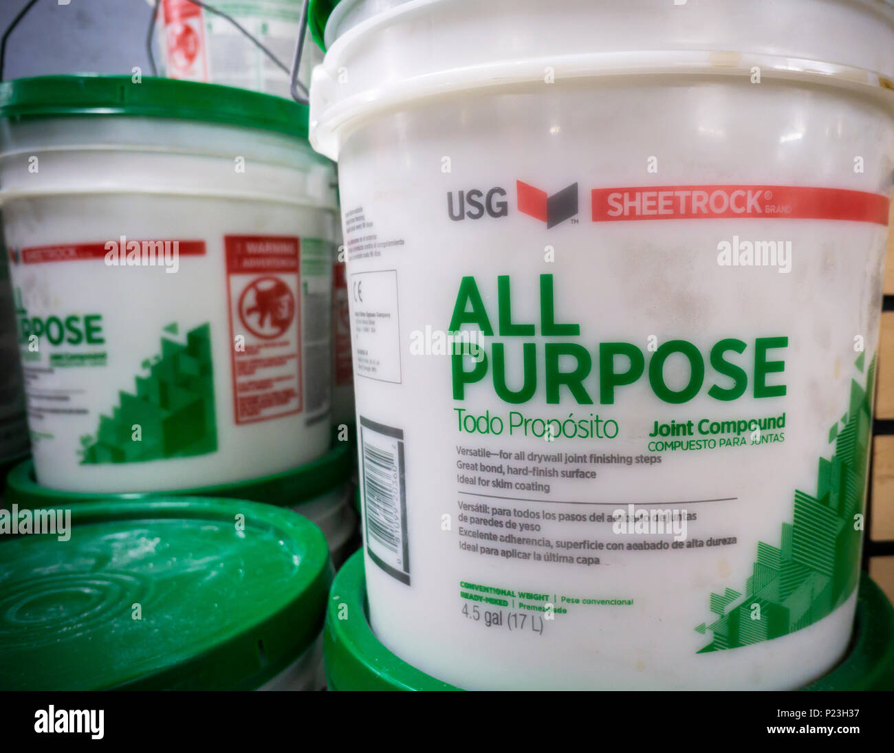 Tubs of USG brand all-purpose joint compound in a hardware store in New ...