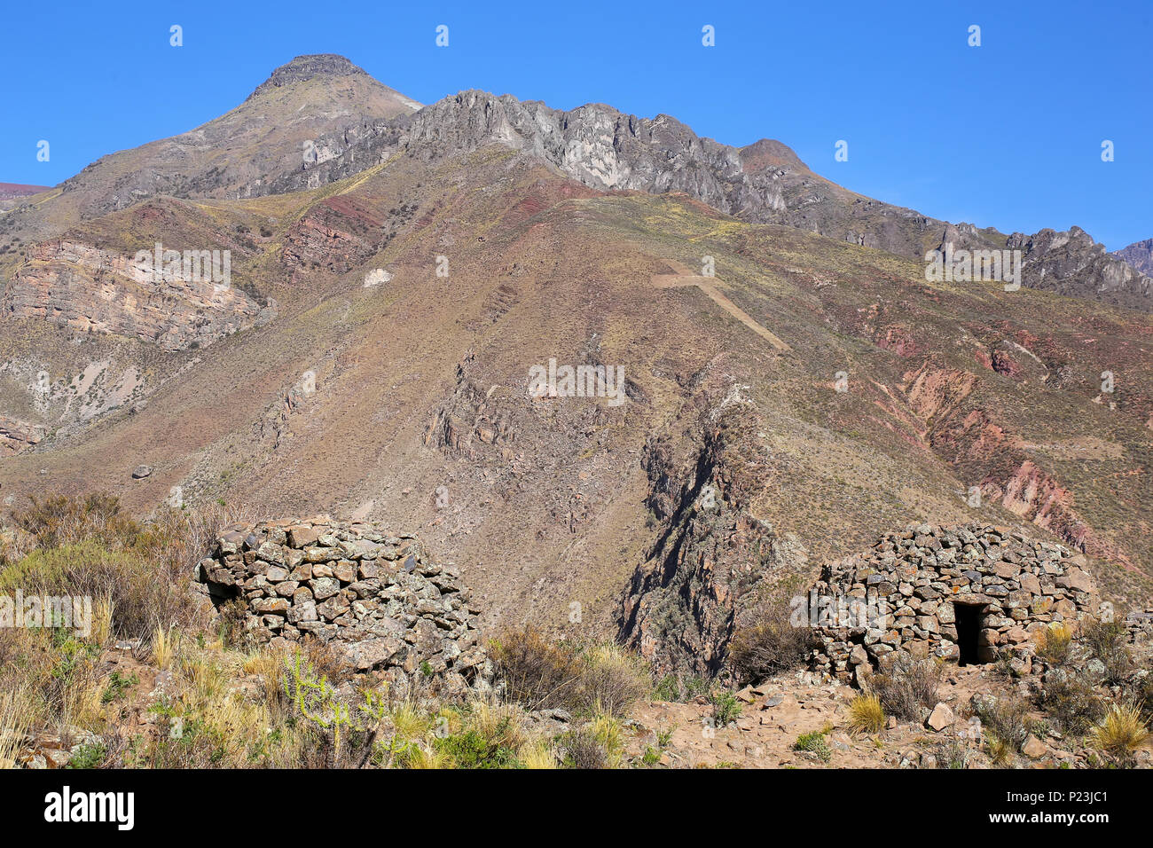 Pre-Incan round houses named colca near Chivay in Peru. Colcas are ...