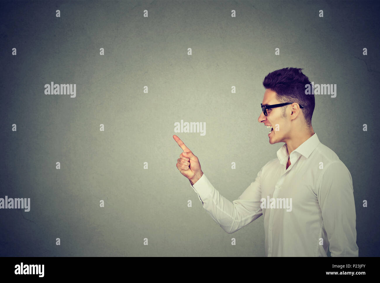 Handsome guy pointing finger up hi-res stock photography and images - Alamy