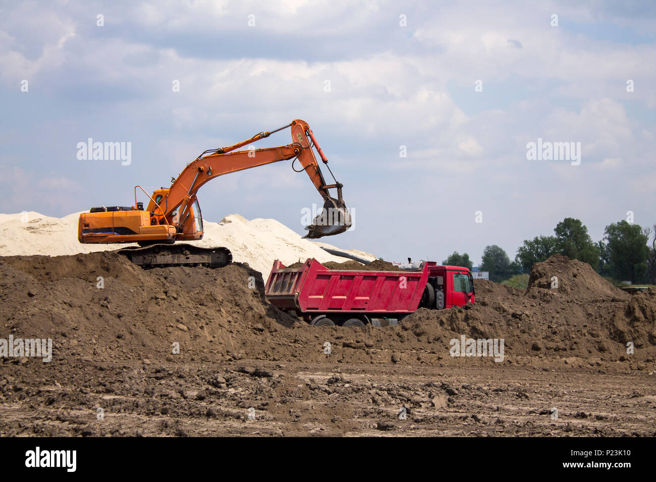 Photo of excavator and dumper truck. Construction site digger ...