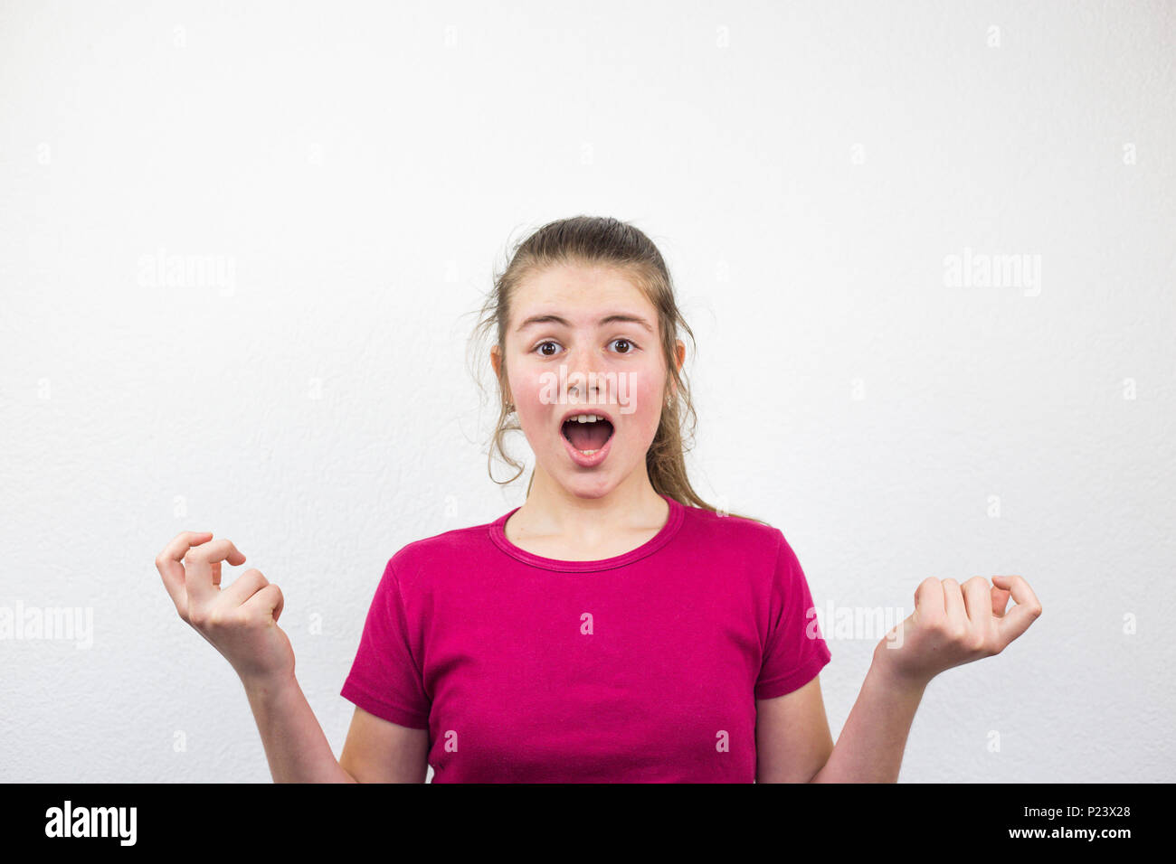 Young and beautiful blonde teenage girl yelling and shouting in ...