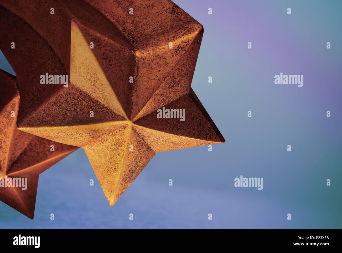 Rising shooting star, gold or bronze colored material, with copy space ...