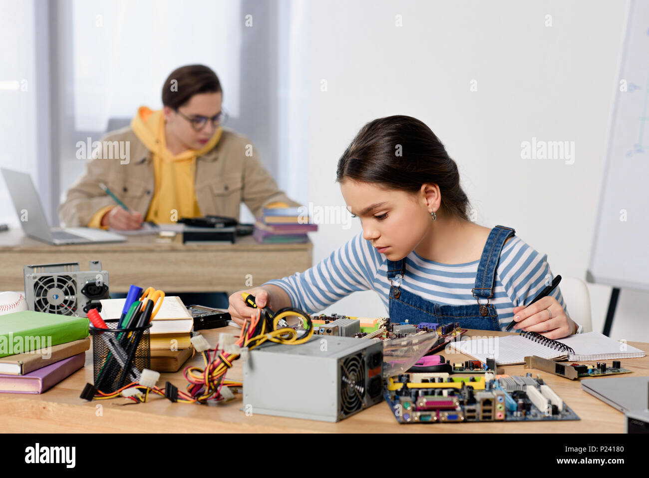 teenagers studying and fixing computer motherboard at home Stock Photo ...