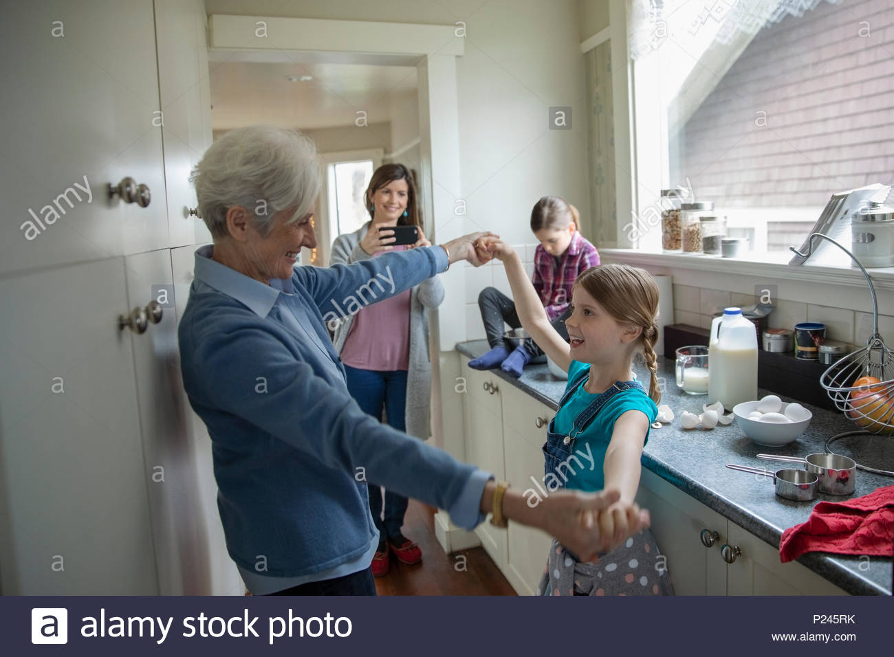 Caucasian girl dancing in kitchen hi-res stock photography and images ...