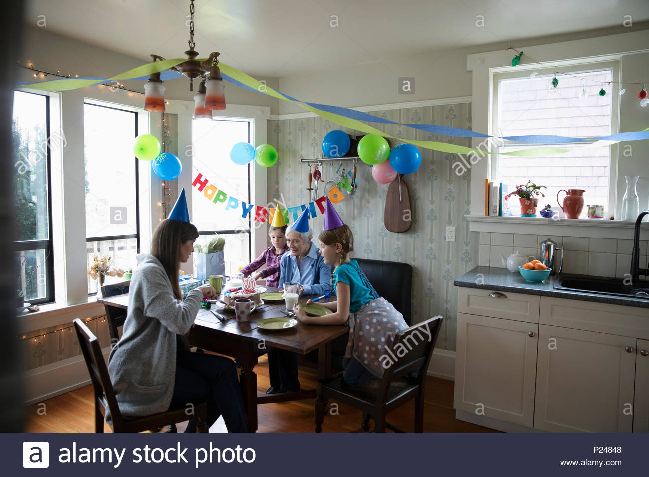 Grandmother and granddaughter celebrating a birthday hi-res stock ...