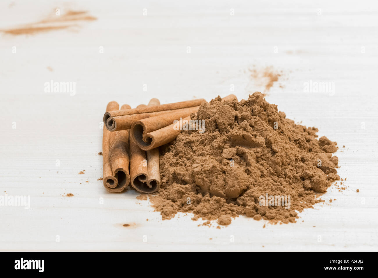 Cinnamon sticks with powder hi-res stock photography and images - Alamy