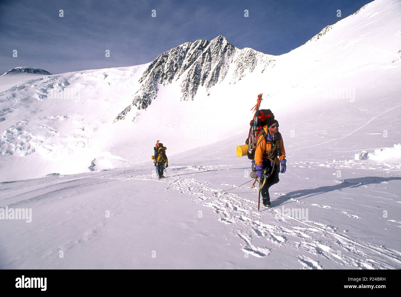 two male climbers arrive at the 17,000' camp on Denali, Alaska Stock ...