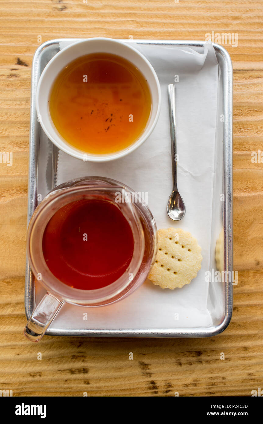 British chai tea with pitcher and biscuit cookie Stock Photo - Alamy