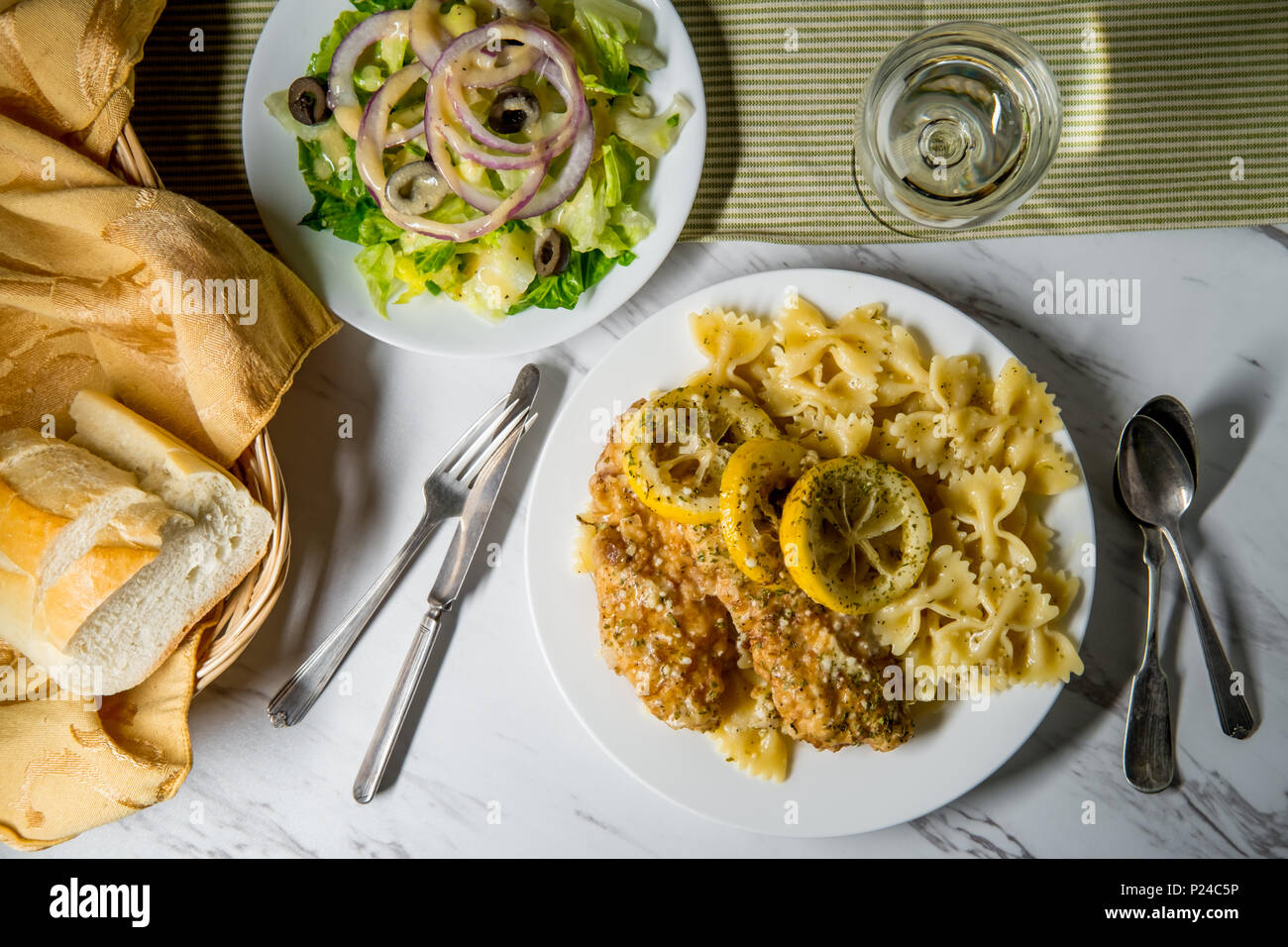 Italian American Chicken francese with farfalle pasta and side salad ...